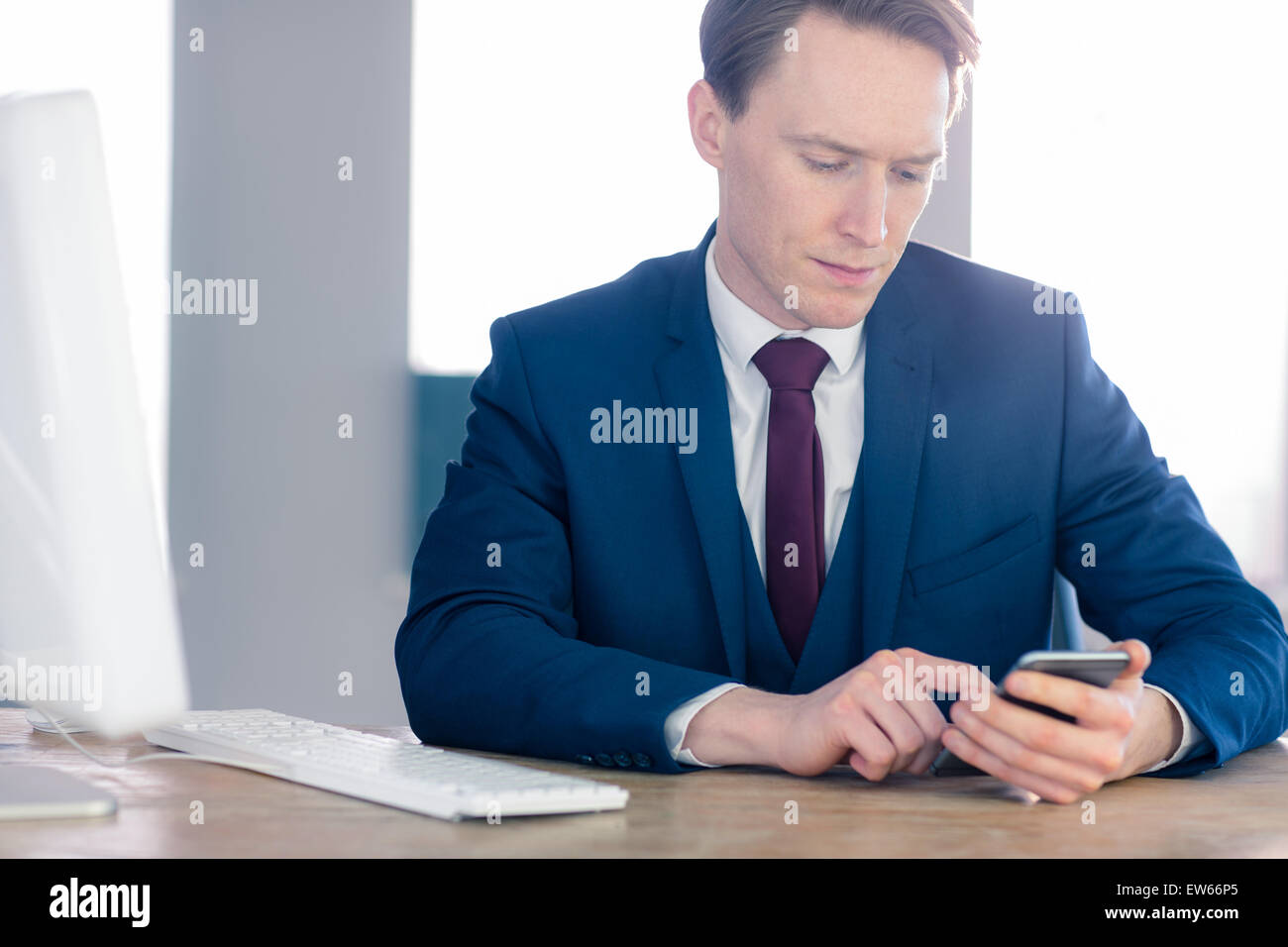 Serious businessman using smartphone hi-res stock photography and ...
