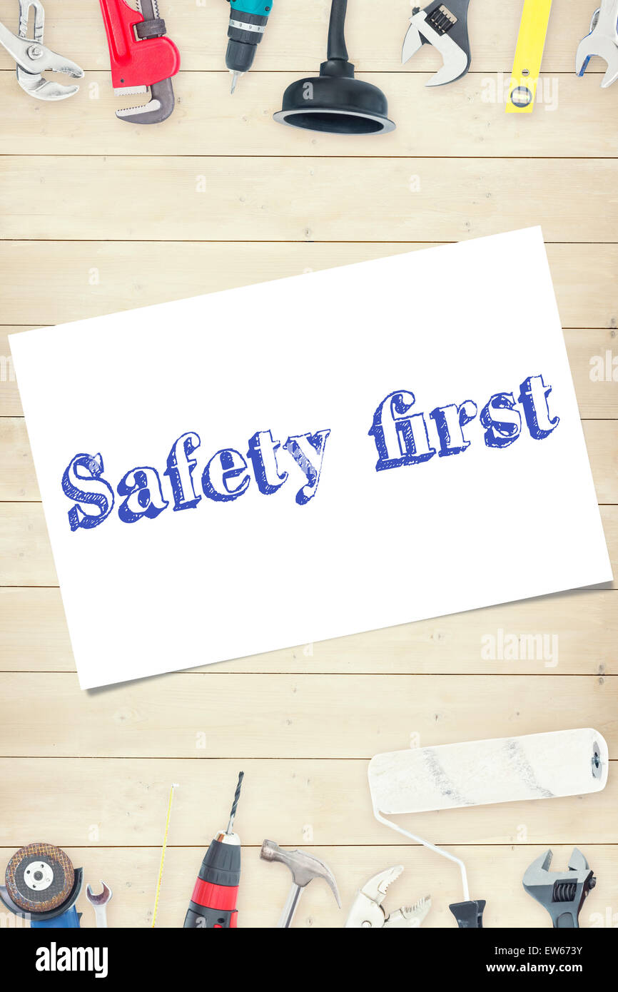 Safety first against tools on wooden background Stock Photo - Alamy
