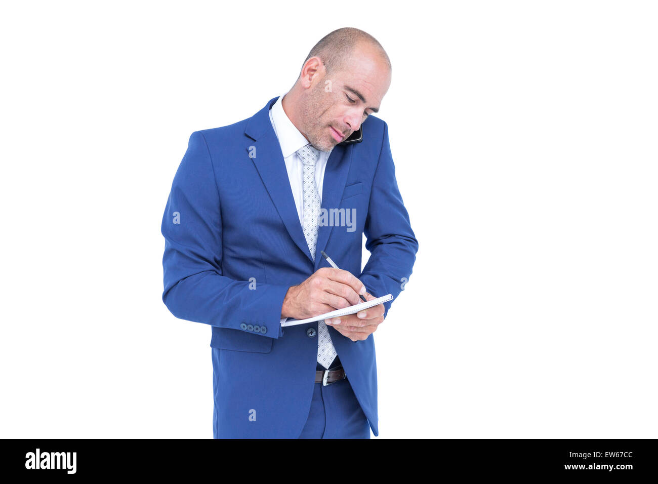 Young businessman writing on a notepad Stock Photo - Alamy