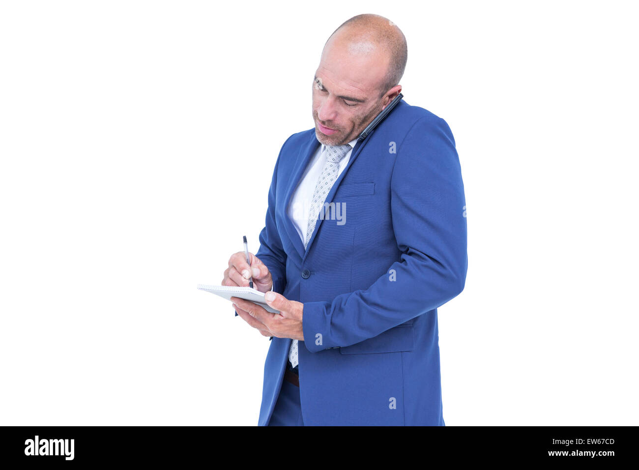 Young businessman writing on a notepad Stock Photo - Alamy