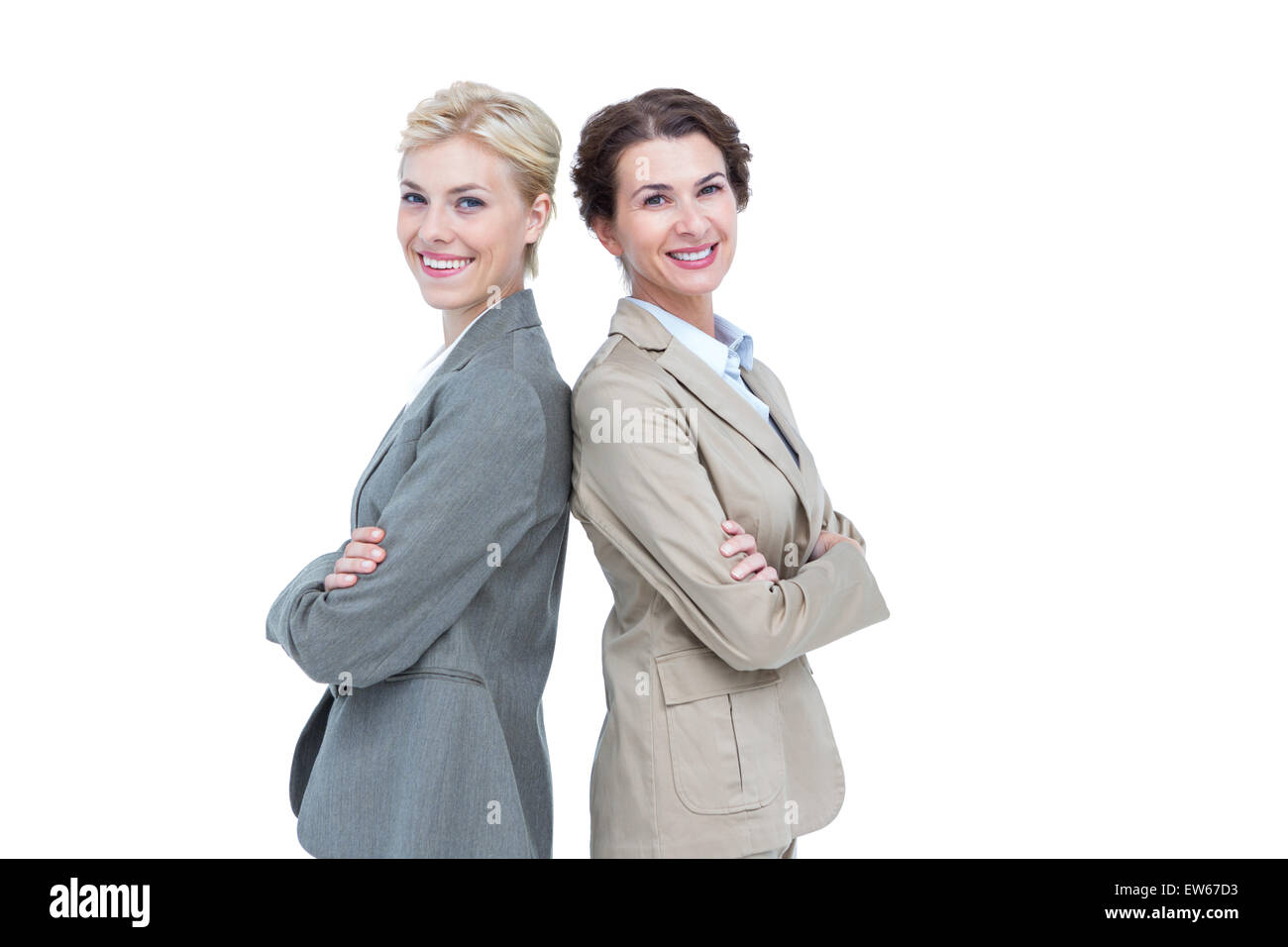 Serious businesswomen standing back on back Stock Photo - Alamy