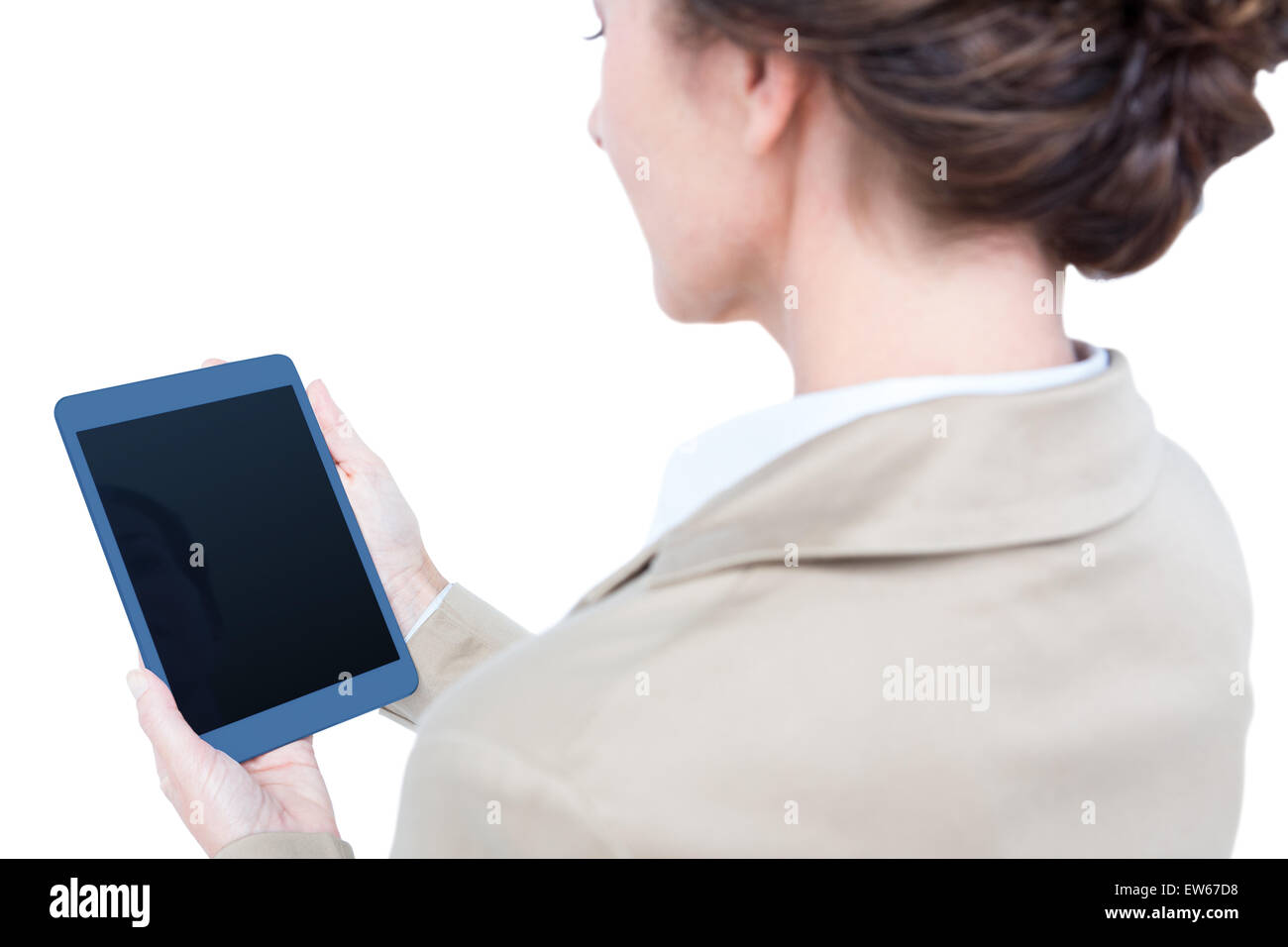 Businesswoman smiling while looking at a tablet Stock Photo - Alamy