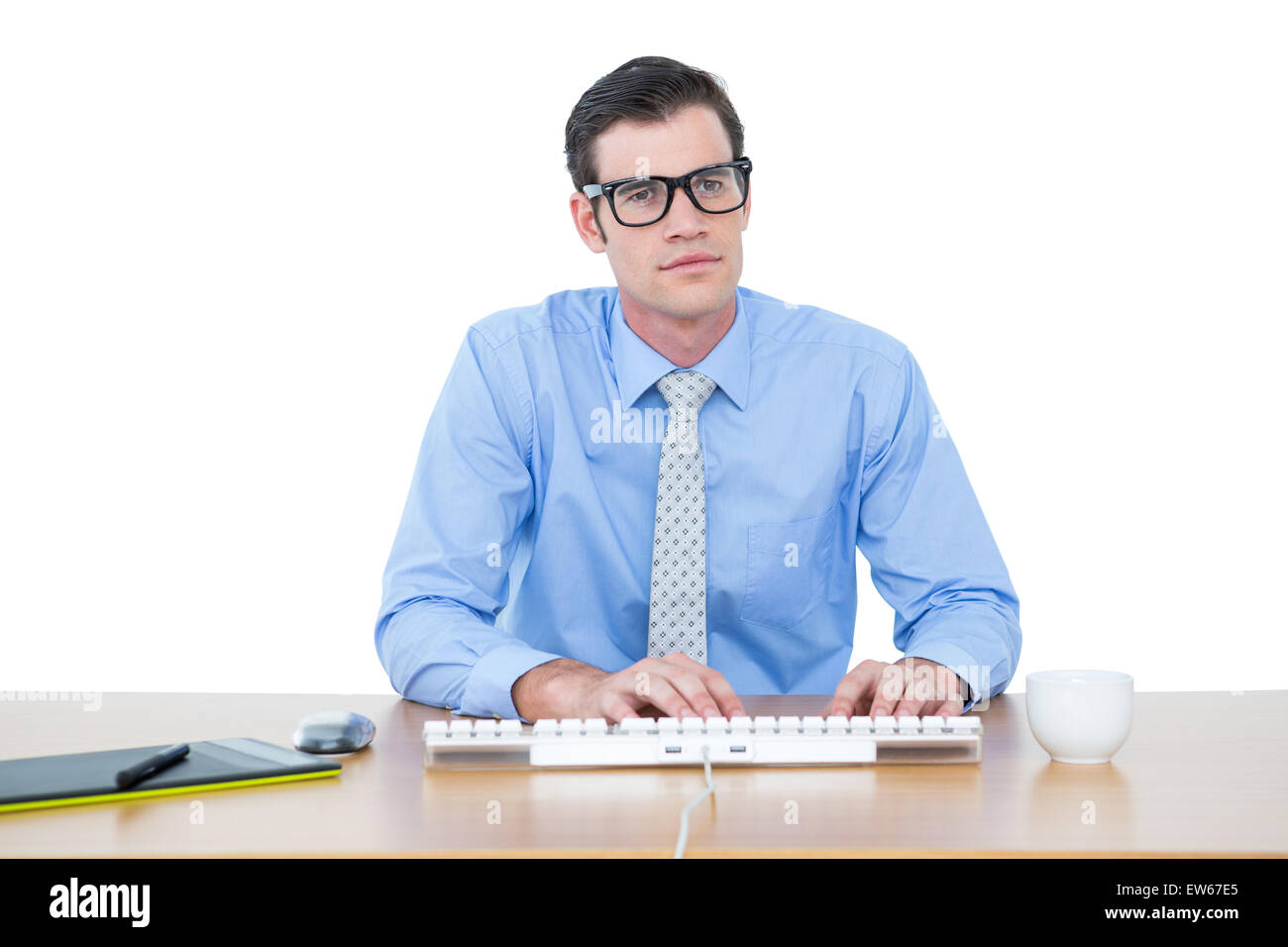 Businessman typing at his desk Stock Photo - Alamy