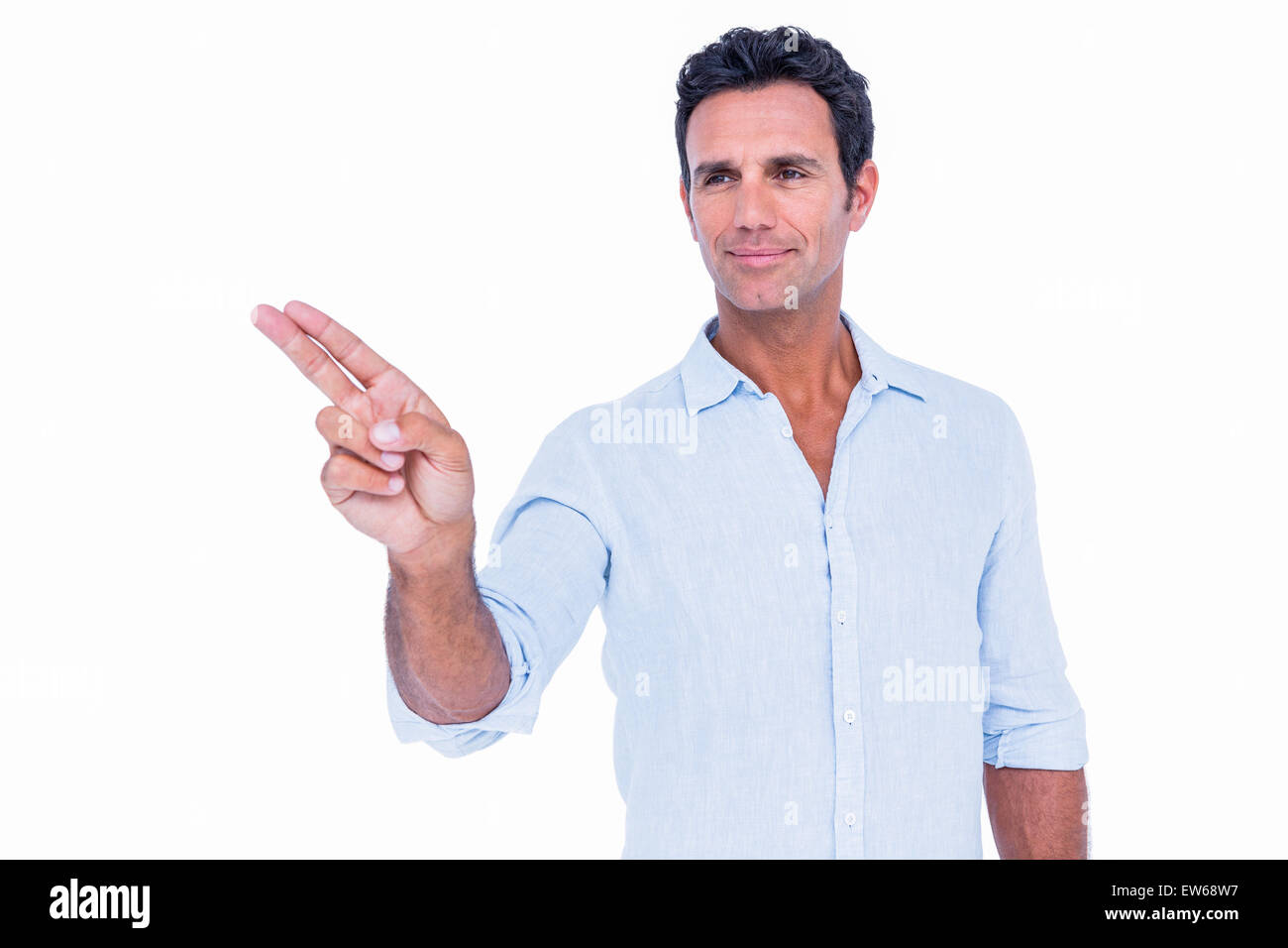 Smiling man pointing fingers on hi-res stock photography and images - Alamy