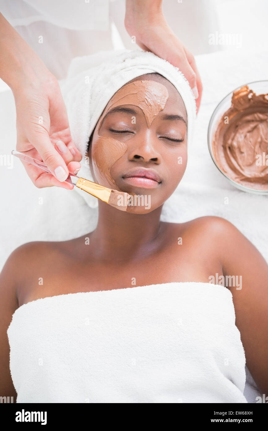 Pretty woman getting a chocolate facial treatment Stock Photo - Alamy