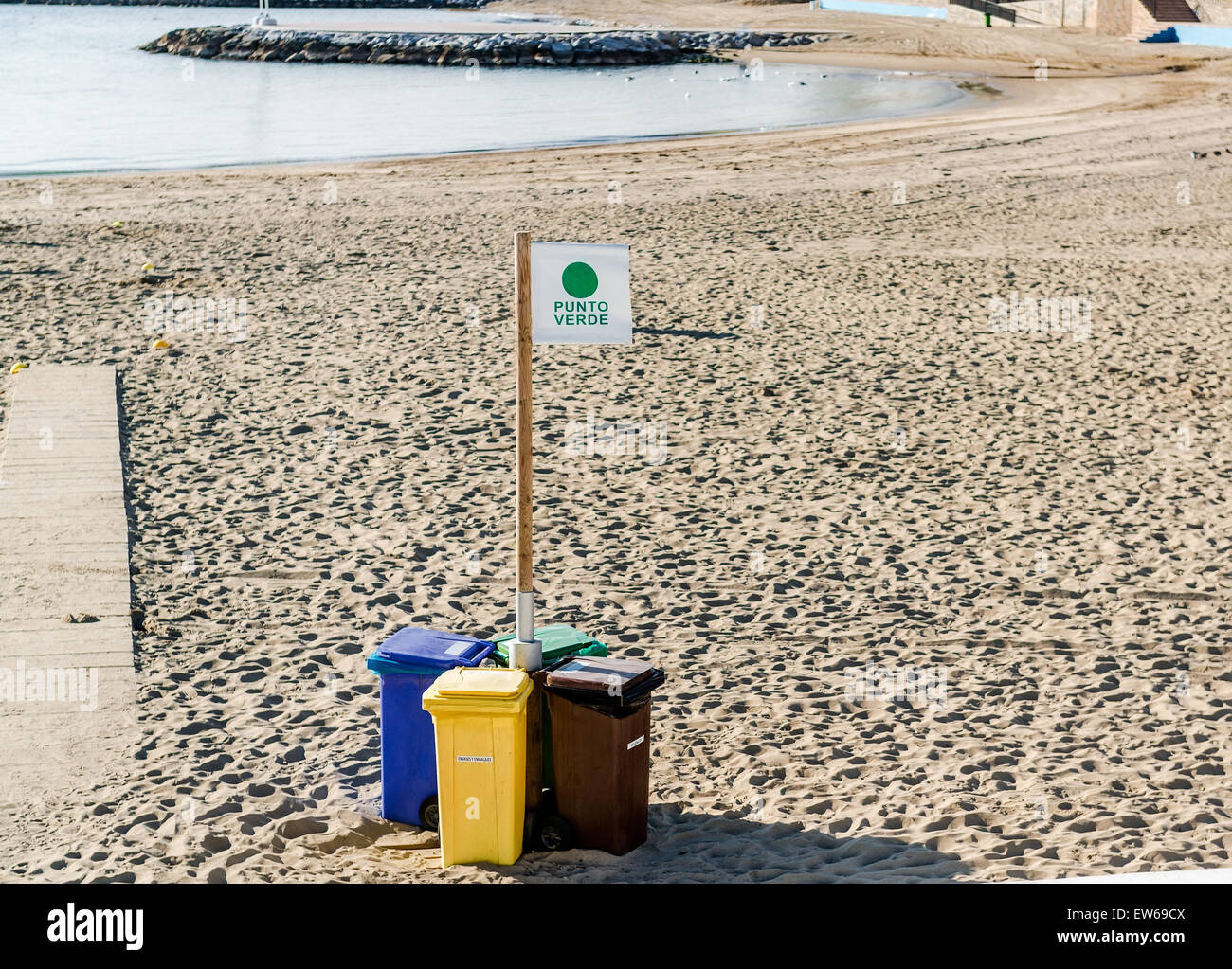 Four garbage containers for separate types of trash Stock Photo - Alamy