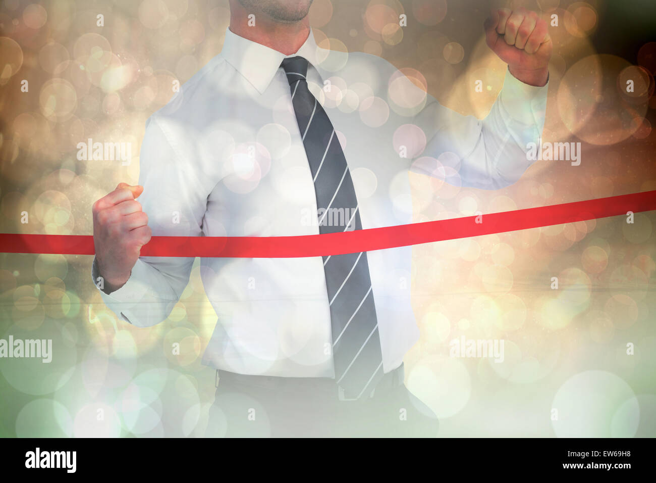 Composite image of businessman crossing the finish line Stock Photo - Alamy