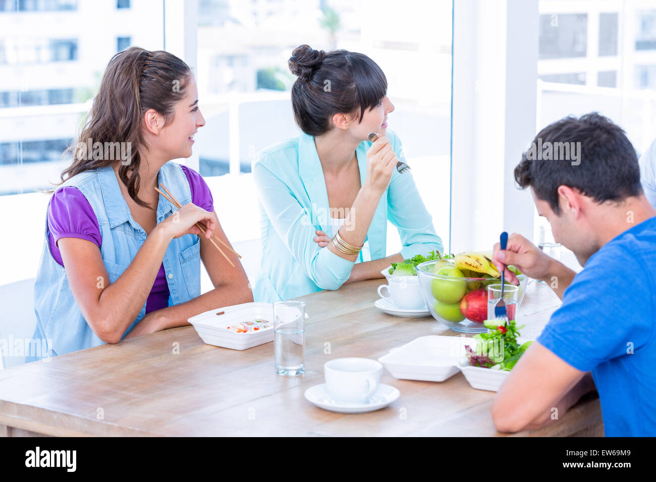 Group of friend eating together Stock Photo - Alamy