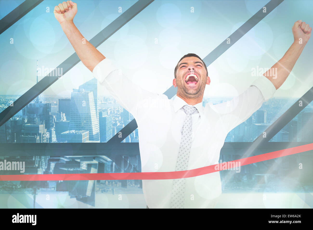 Composite image of businessman crossing the finish line Stock Photo - Alamy