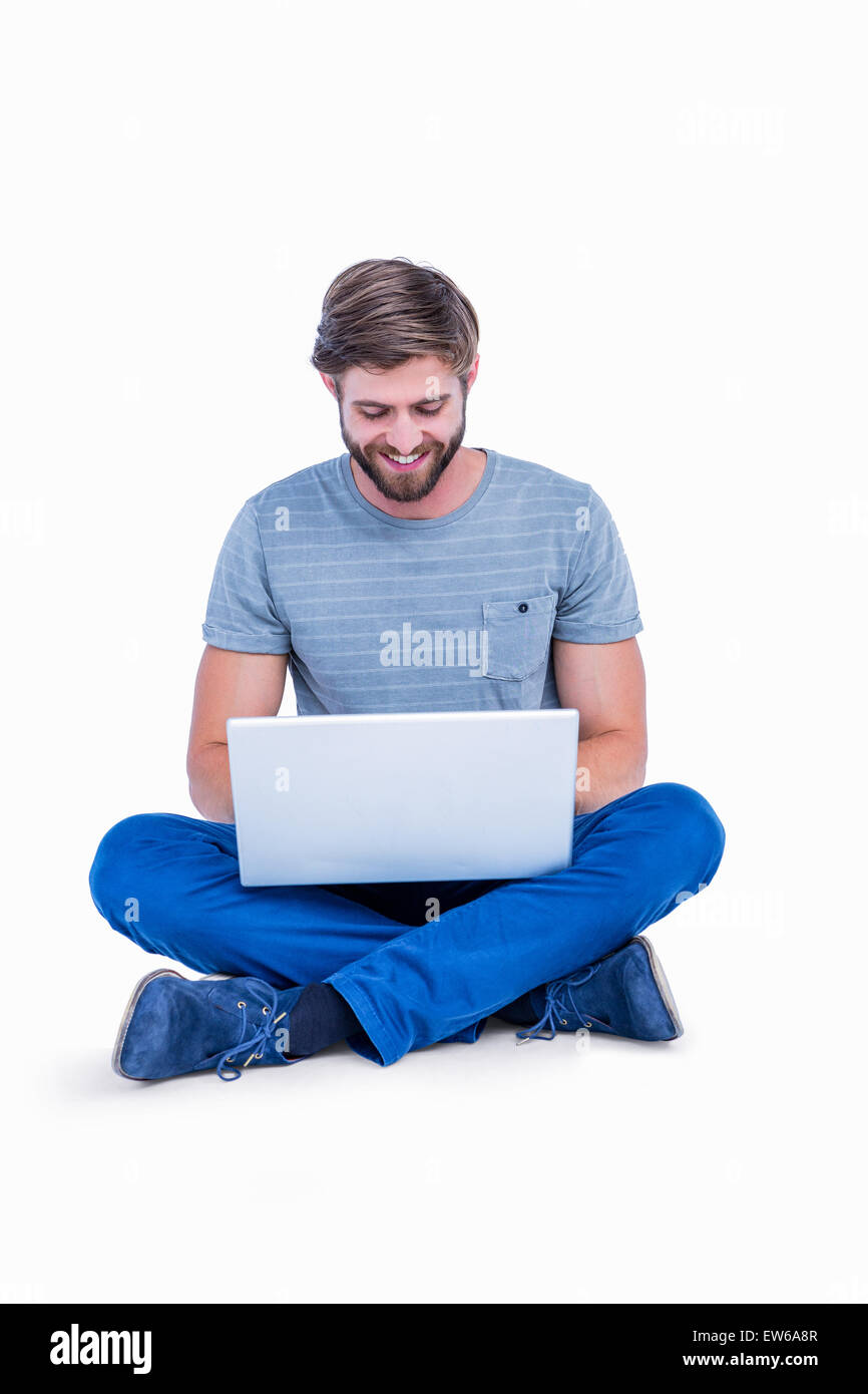 Handsome man thinking behind his laptop Stock Photo - Alamy