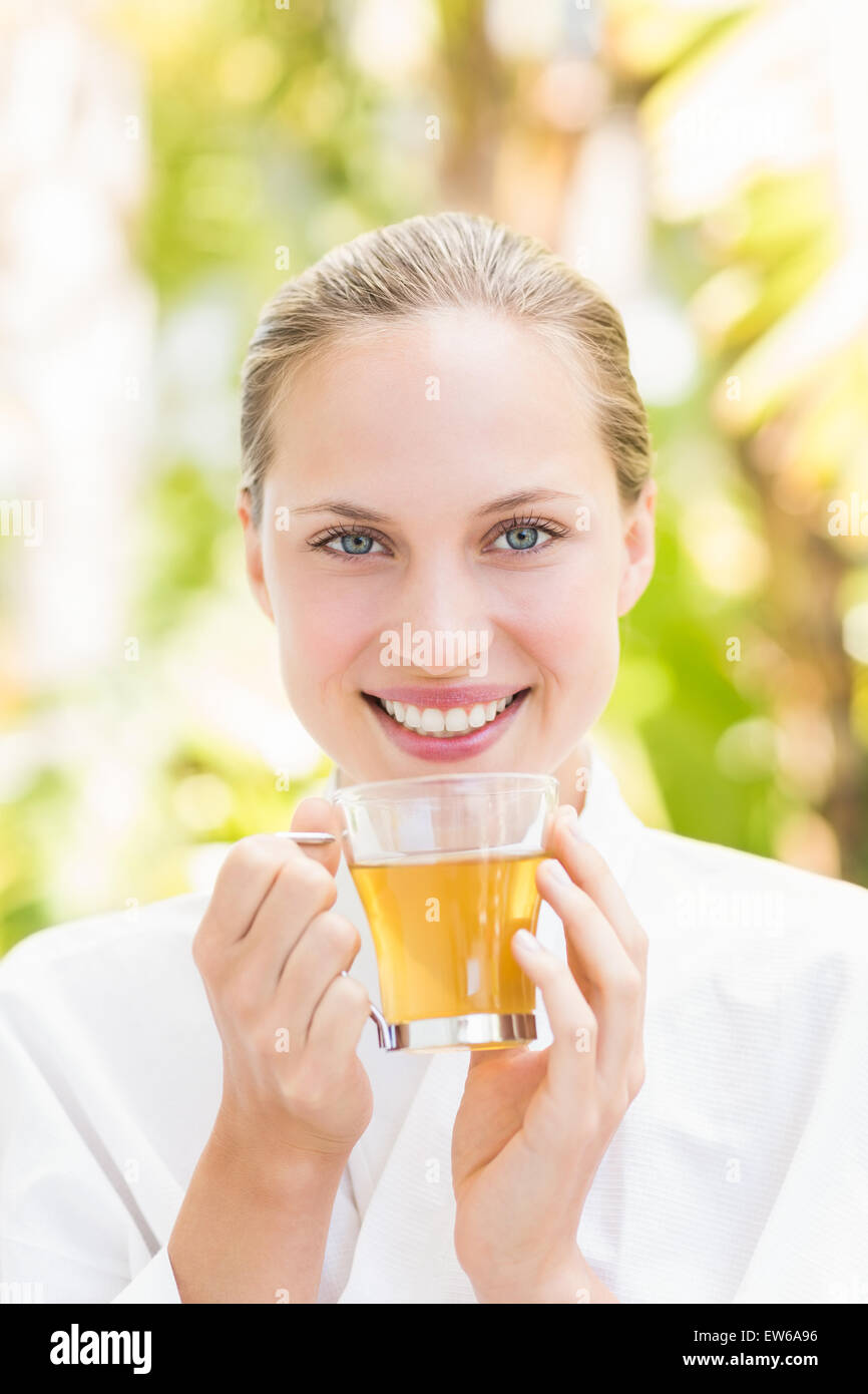 Attractive woman drinking tea Stock Photo - Alamy