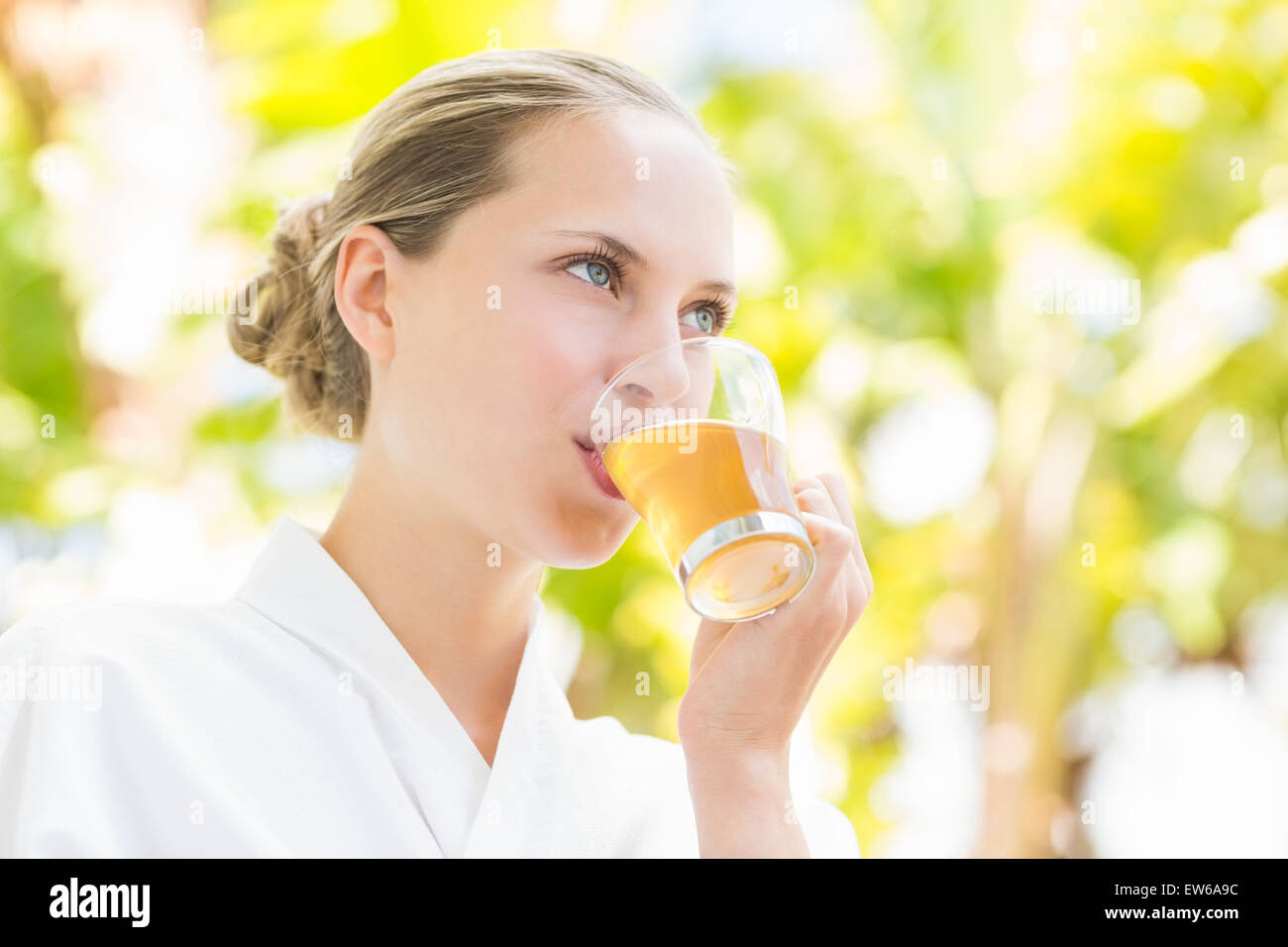 Attractive woman drinking tea Stock Photo - Alamy
