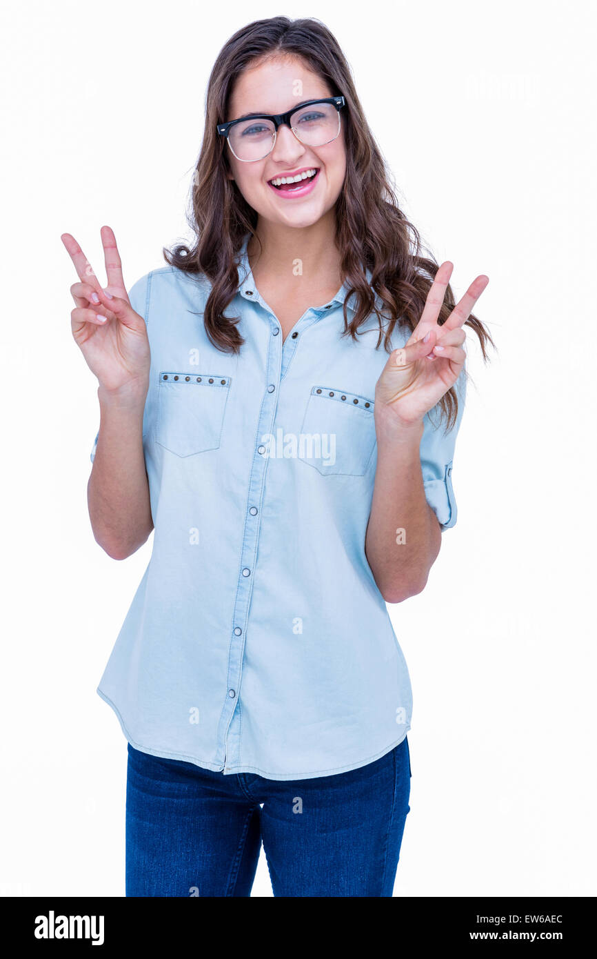 Woman smiling making peace sign hi-res stock photography and images - Alamy
