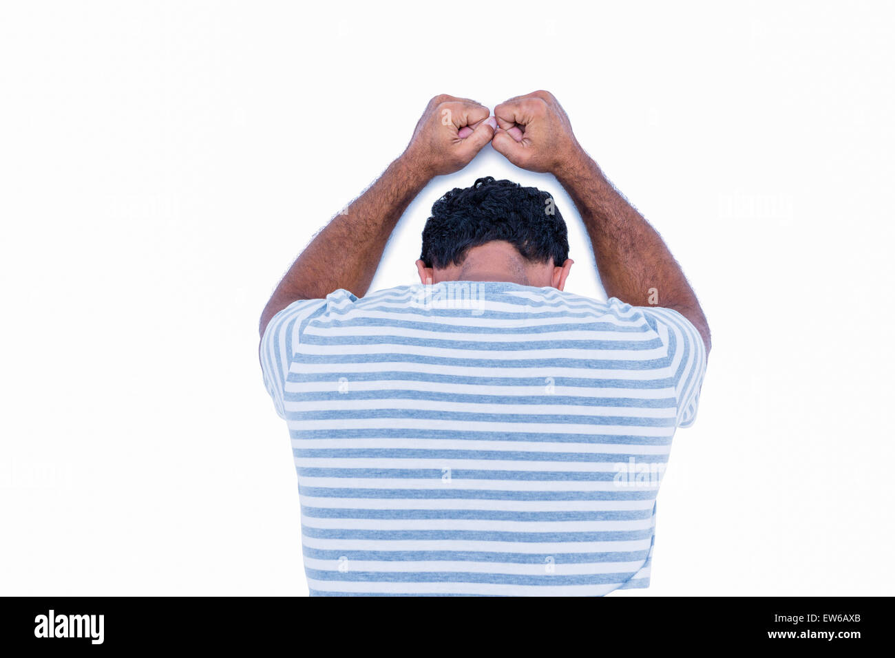 Rear view of sad man leaning his head against a wall Stock Photo - Alamy