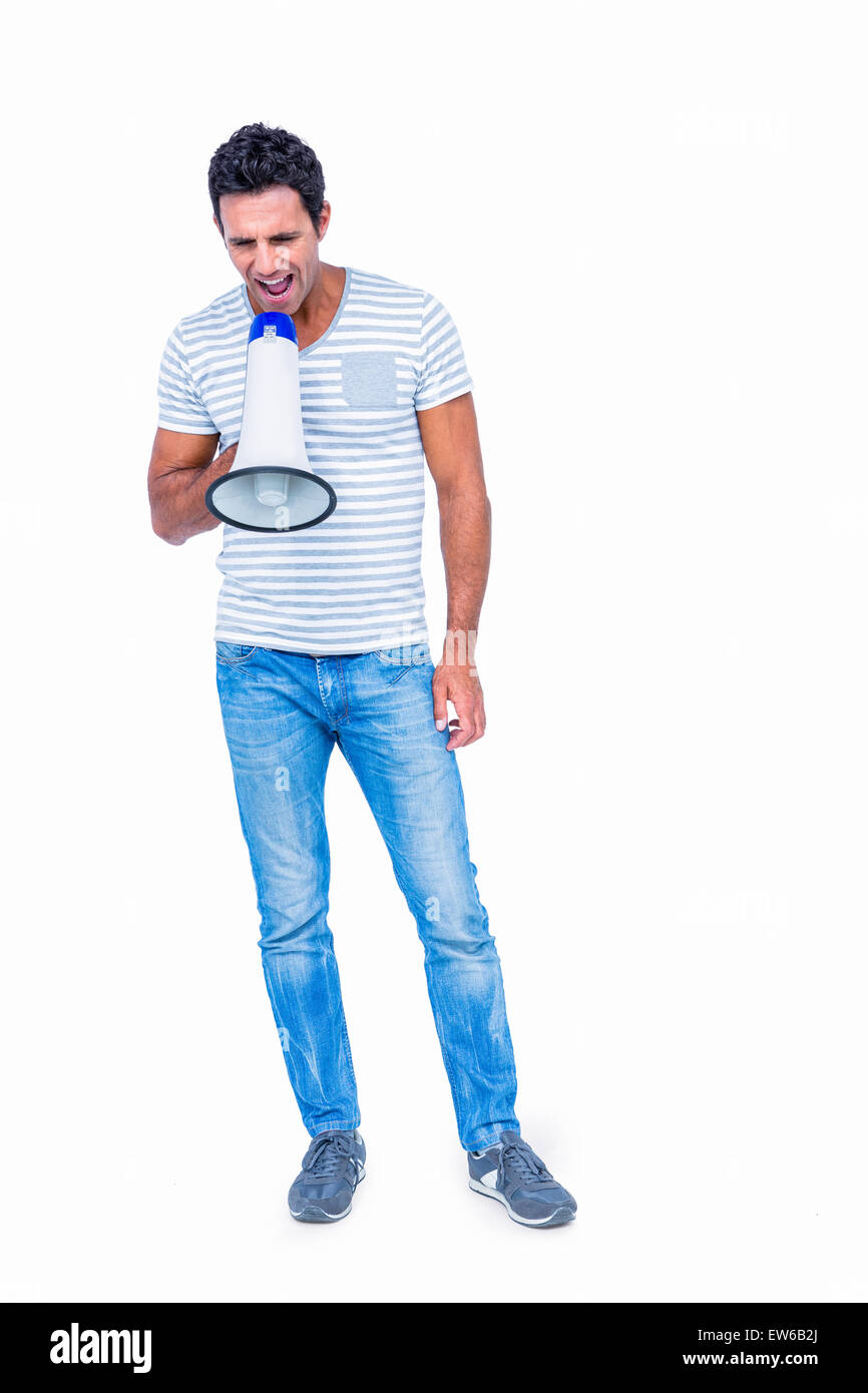 Standing man shouting through megaphone Stock Photo - Alamy