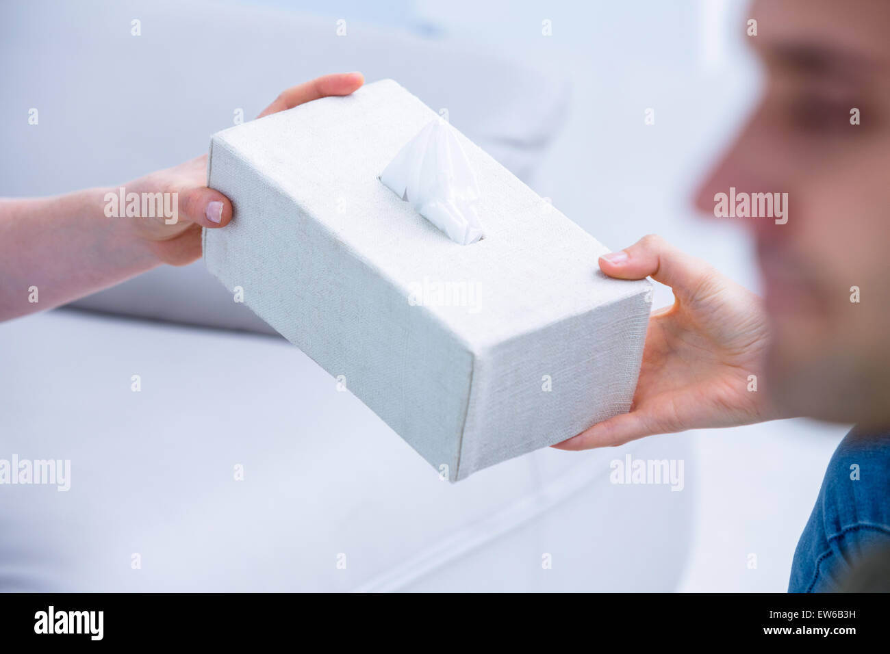 Businesswoman giving paper tissue to her colleague Stock Photo - Alamy