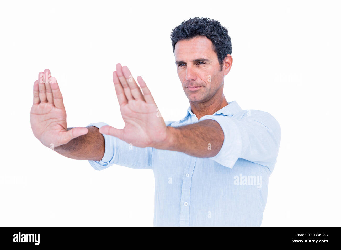 Handsome man stretching his arms Stock Photo - Alamy