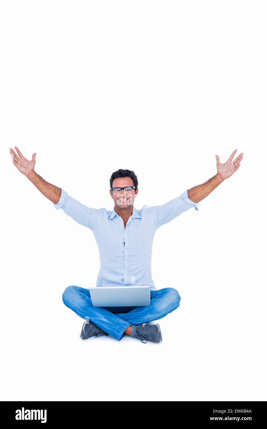 Happy handsome man cheering arms hi-res stock photography and images ...