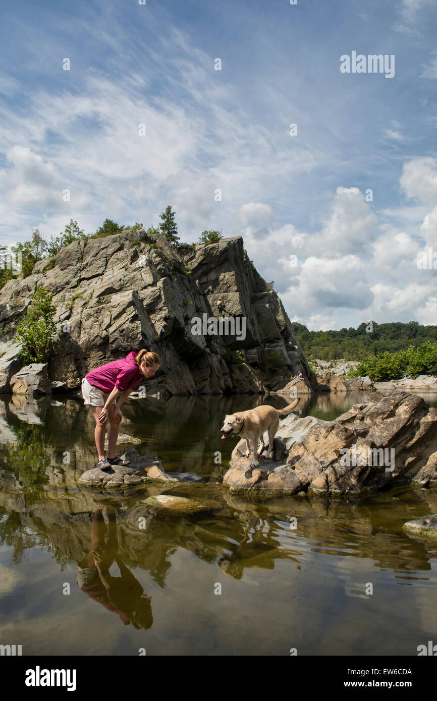A woman hikes and rock climbs on the Billy Goat Trail in Great Falls ...