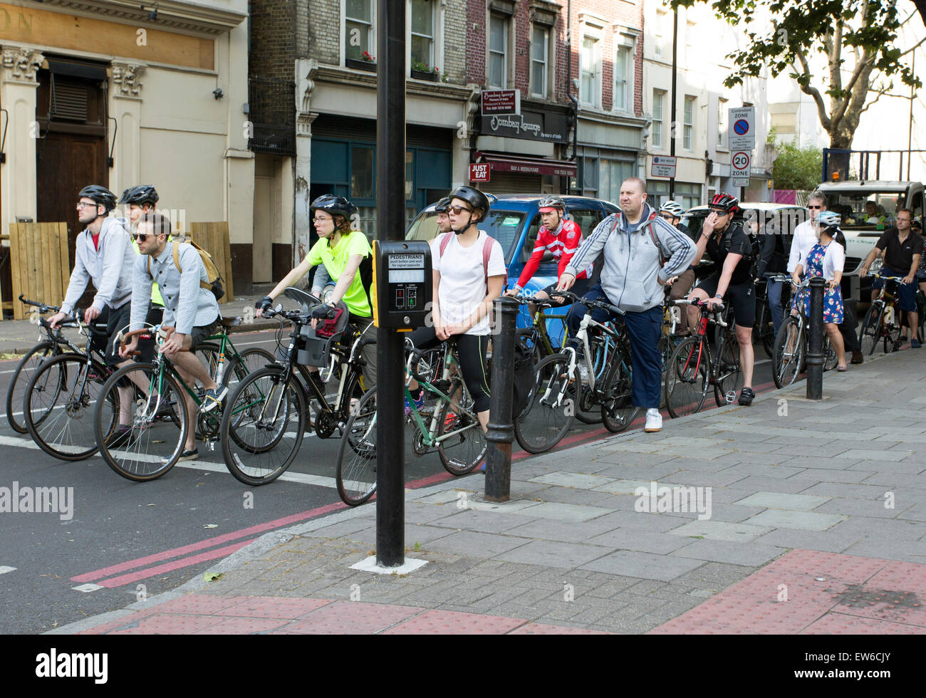 Cyclists commuting to work in London morning rush hour - large group ...