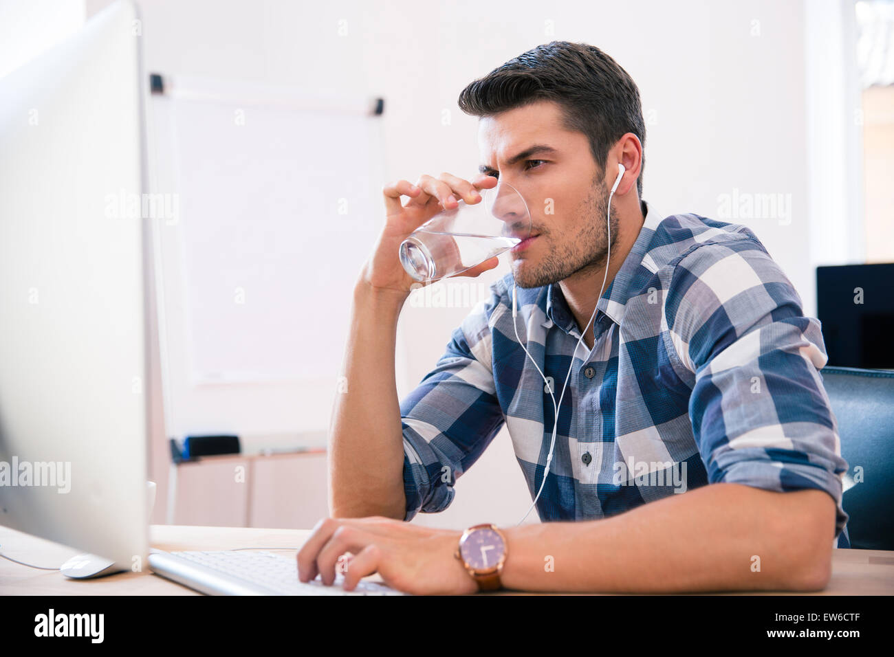 Drinking water in the office man hi-res stock photography and images ...