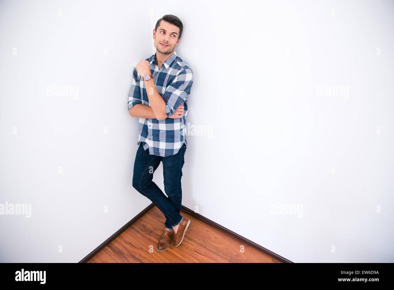 Businessman standing in corner office hi-res stock photography and ...