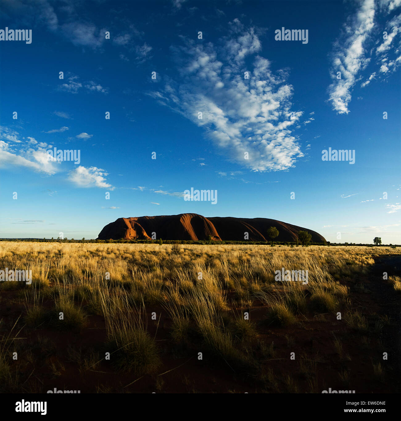 The sunrises over Uluru, Australia's sacred sandstone rock, more ...