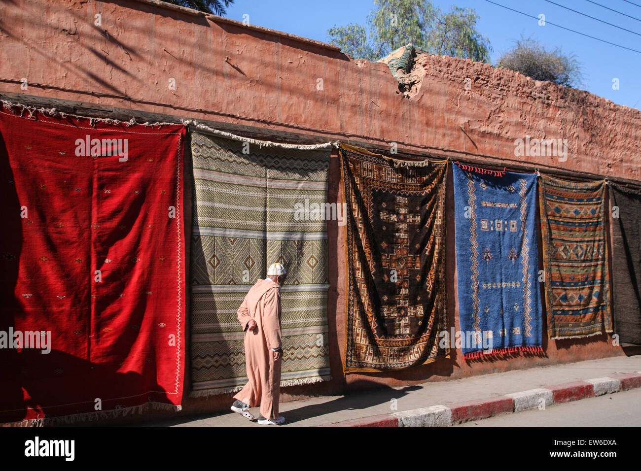 Local man wearing long-hooded cloak known as a djellaba, worn by both ...