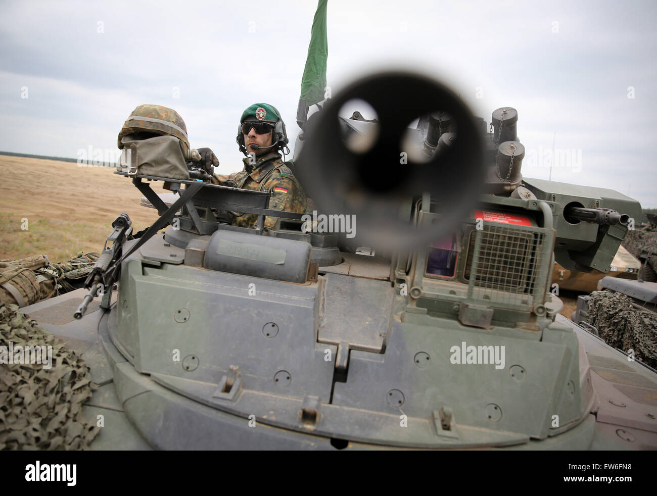 Sagan, Poland. 18th June, 2015. A German soldier sweeps the area from ...