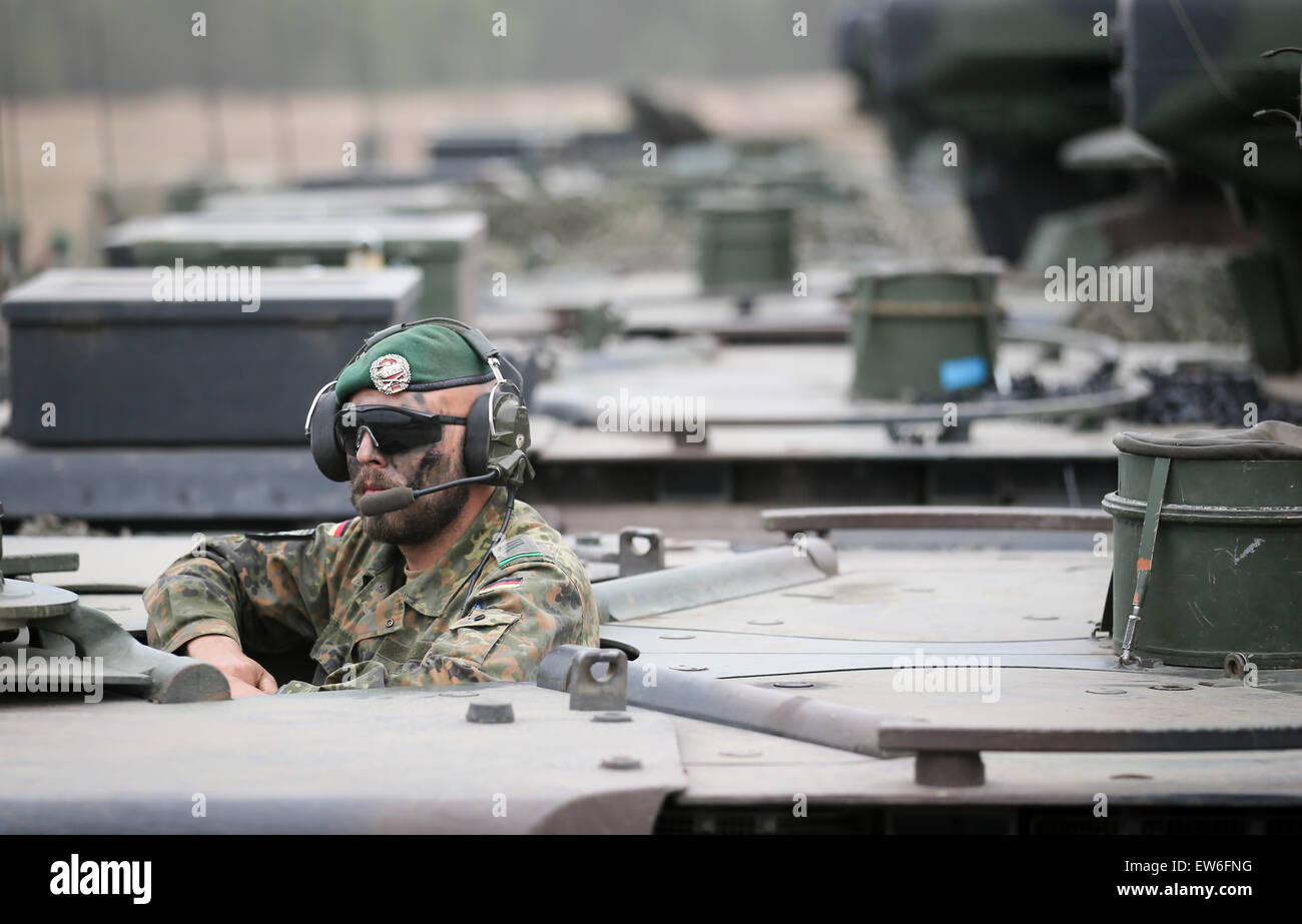 Sagan, Poland. 18th June, 2015. A German soldier monitors the area from ...