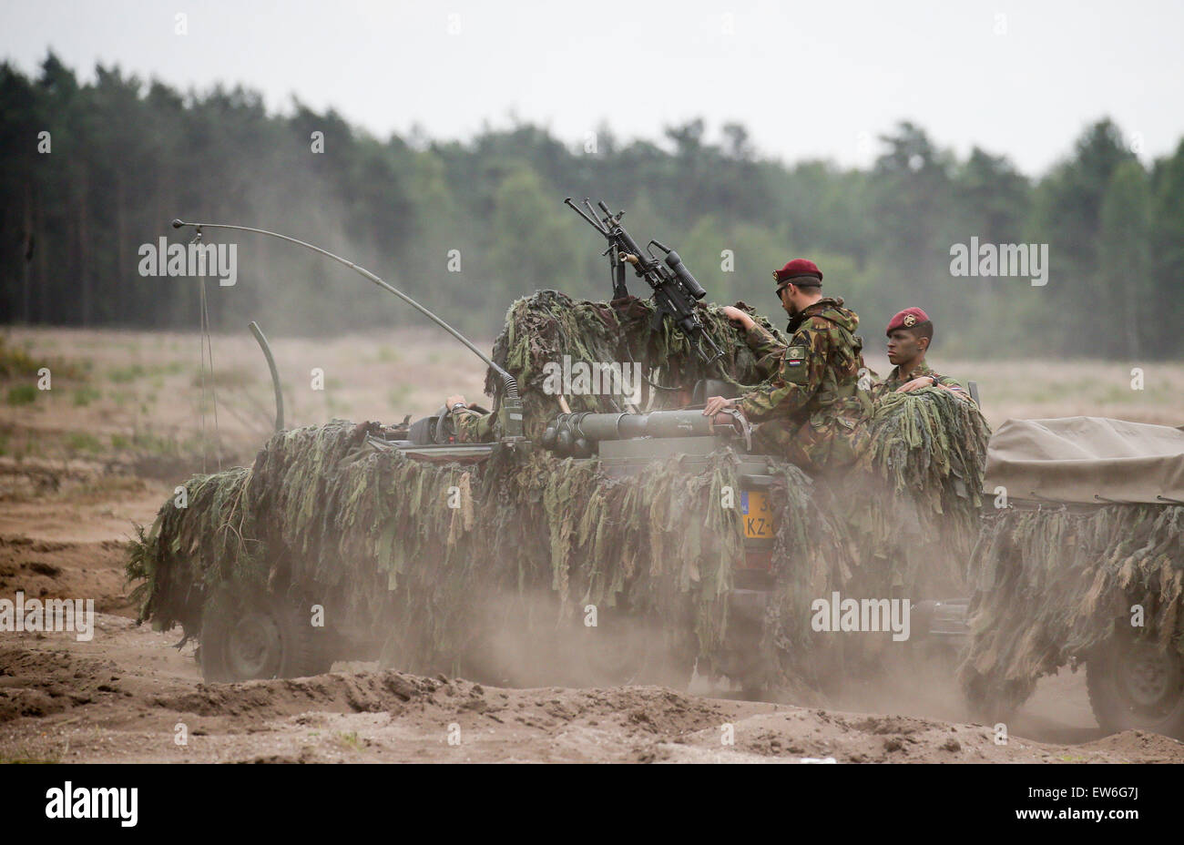 Sagan, Poland. 18th June, 2015. NATO soldiers operate in camouflaged ...
