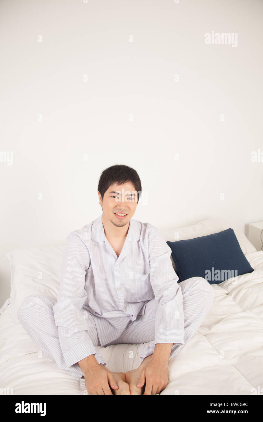 Young man in his bedroom Stock Photo - Alamy