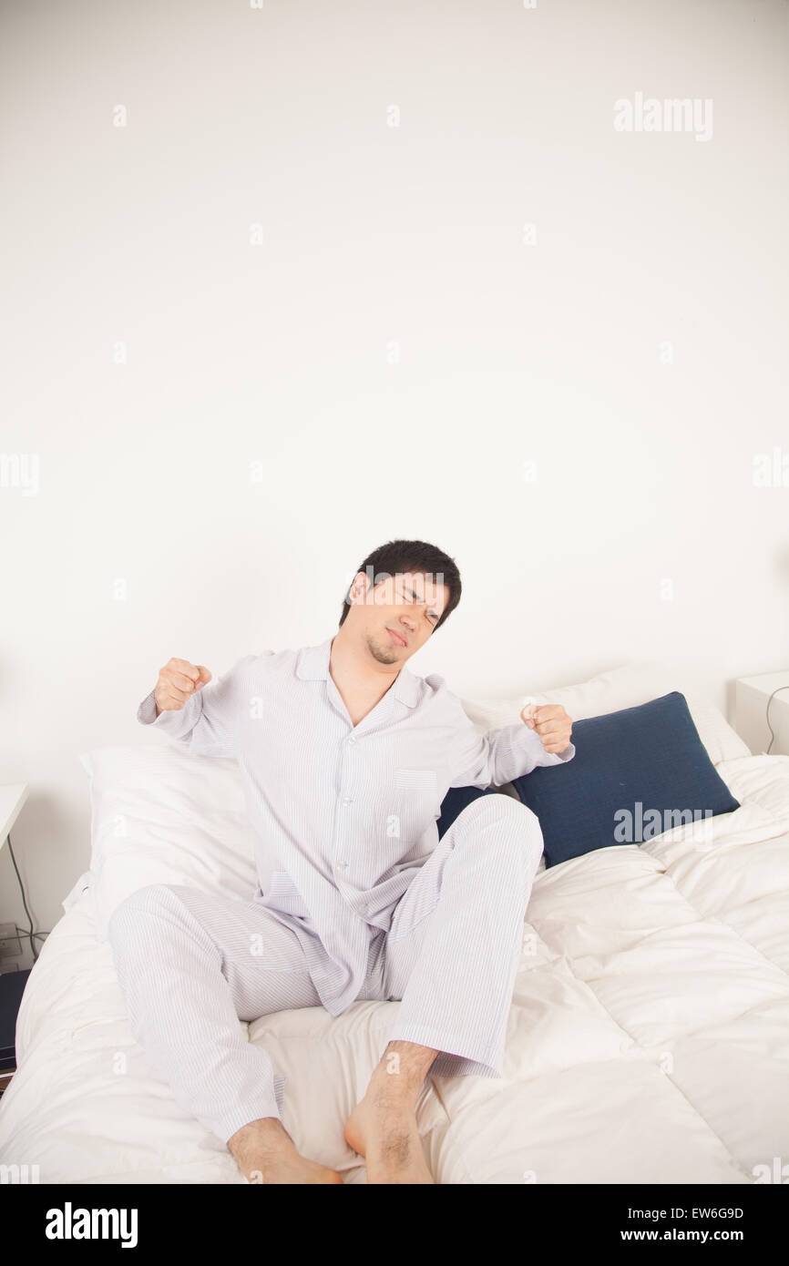 Young man in his bedroom Stock Photo - Alamy