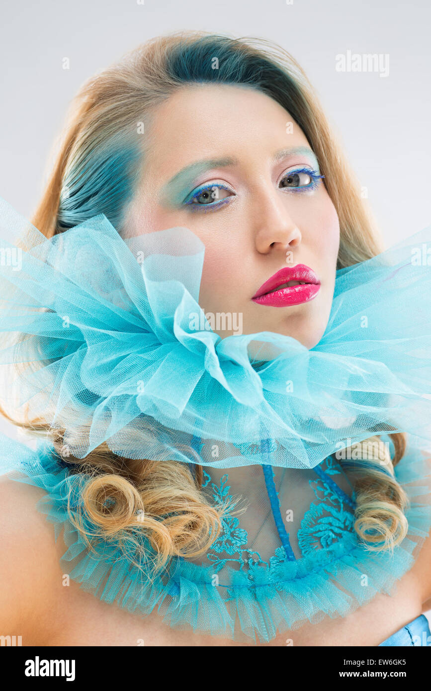 Beautiful woman in blue collar Stock Photo - Alamy