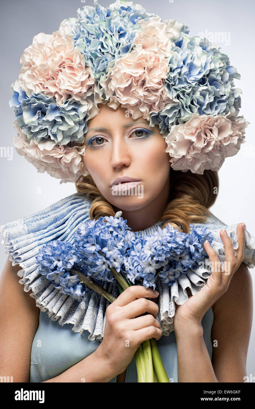 Woman blue flowers hi-res stock photography and images - Alamy