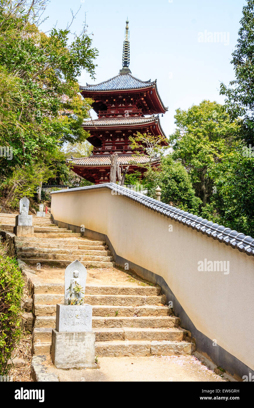 Japan, Onomichi, Saikokuji temple. Flight of stone steps and dobei ...