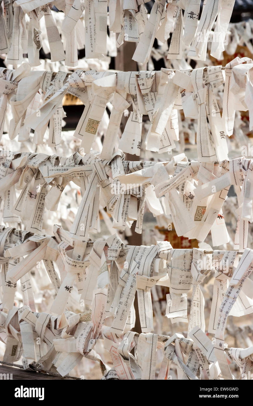 Japan, Kurashiki, Achi-jinja Shrine. Wooden frame with rows of omikuji ...