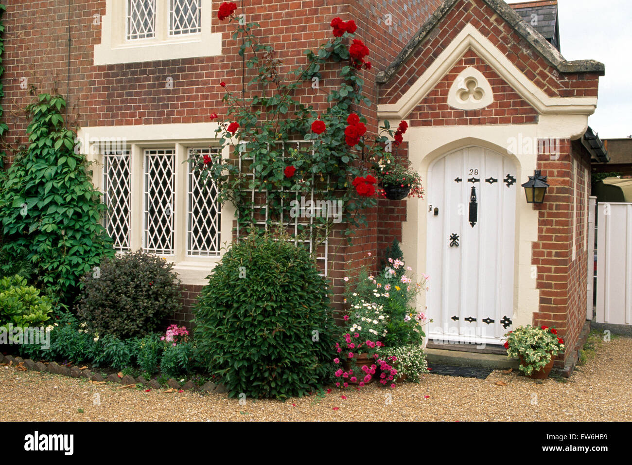 Exterior of house with white front door and windows Stock Photo - Alamy