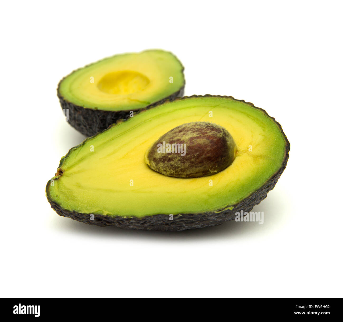 freshly halved avocado pear isolated on white background Stock Photo ...