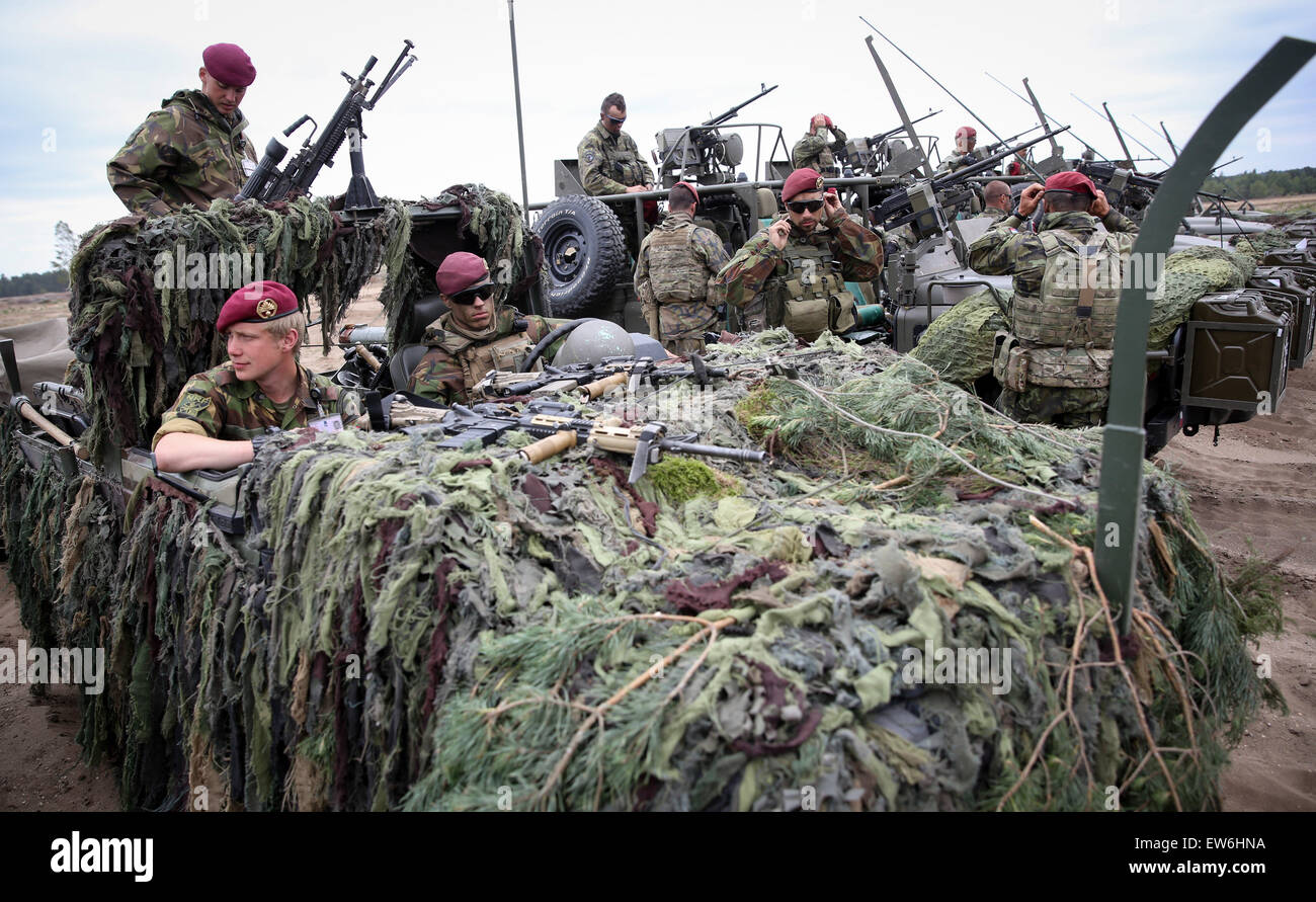 Sagan, Poland. 18th June, 2015. NATO soldiers operate in camouflaged ...