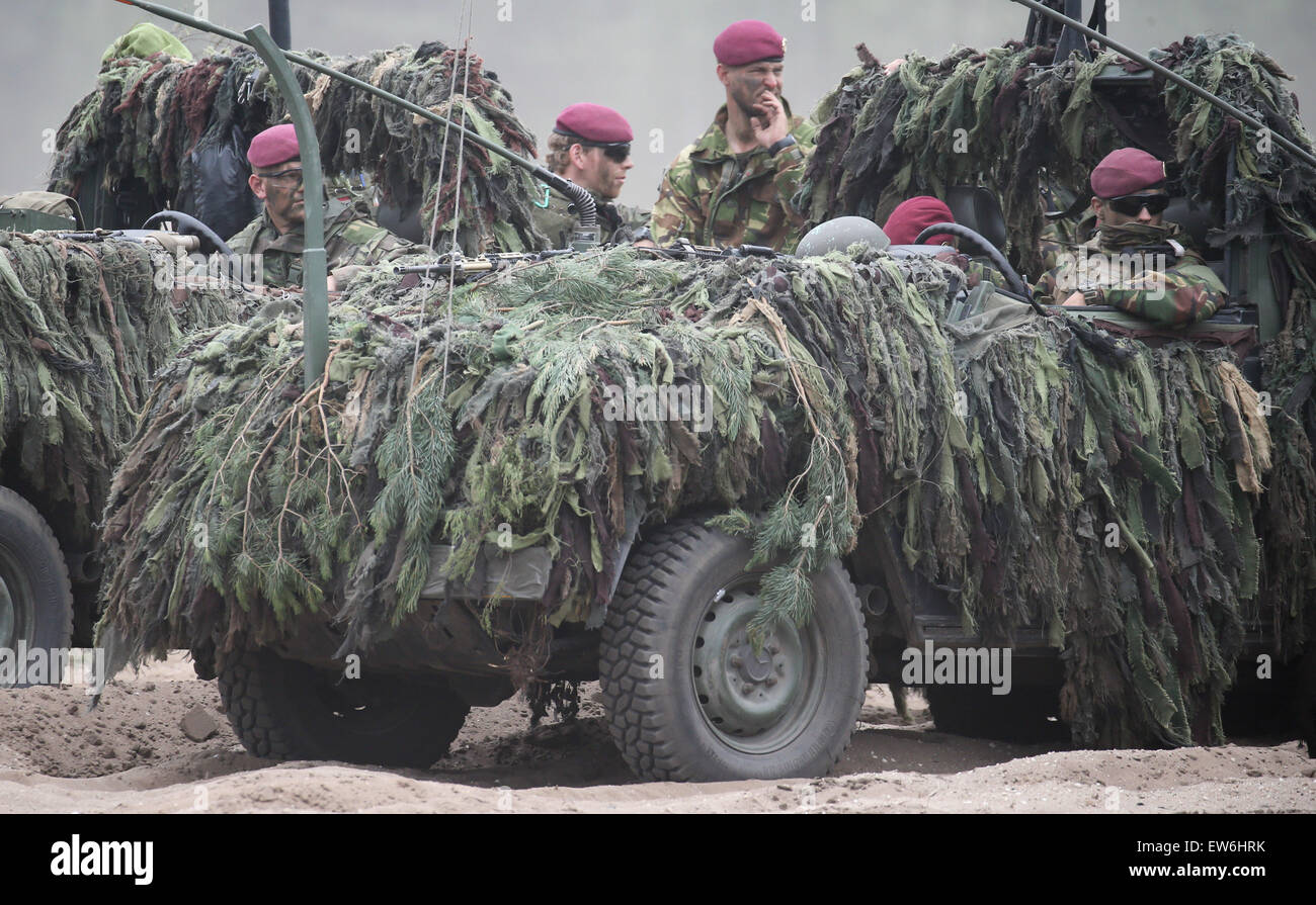 Sagan, Poland. 18th June, 2015. NATO soldiers operate in camouflaged ...