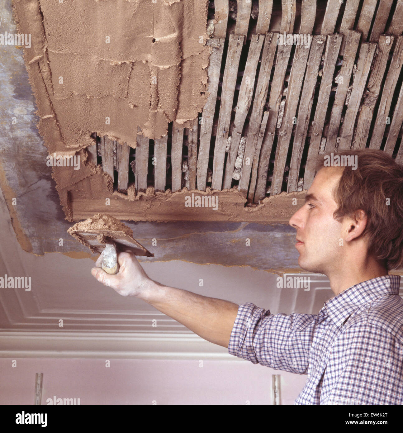 Craftsman plastering a ceiling Stock Photo - Alamy