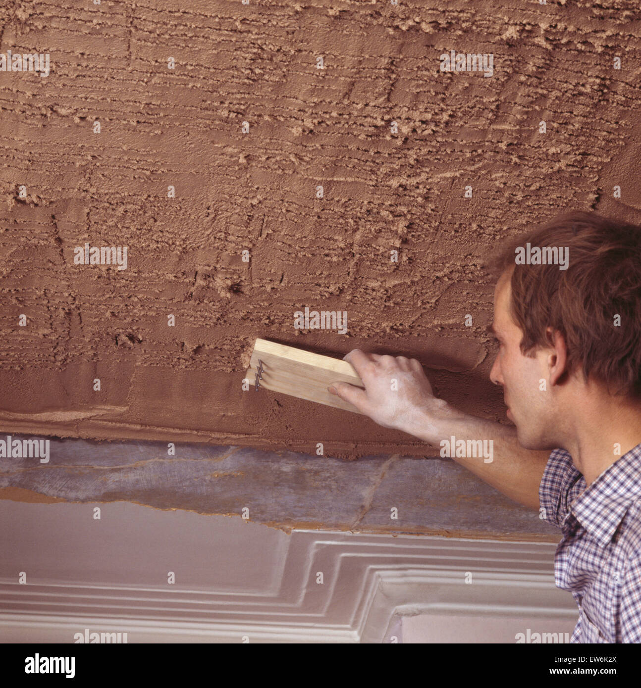 Craftsman plastering a ceiling Stock Photo - Alamy