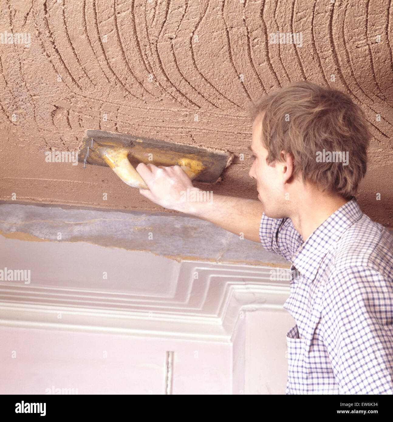 Craftsman plastering a ceiling Stock Photo - Alamy