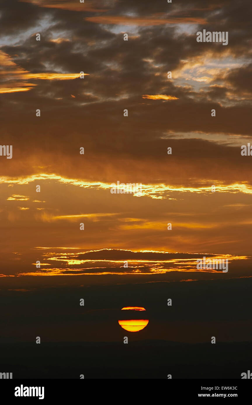sky and setting sun on the horizon Stock Photo - Alamy