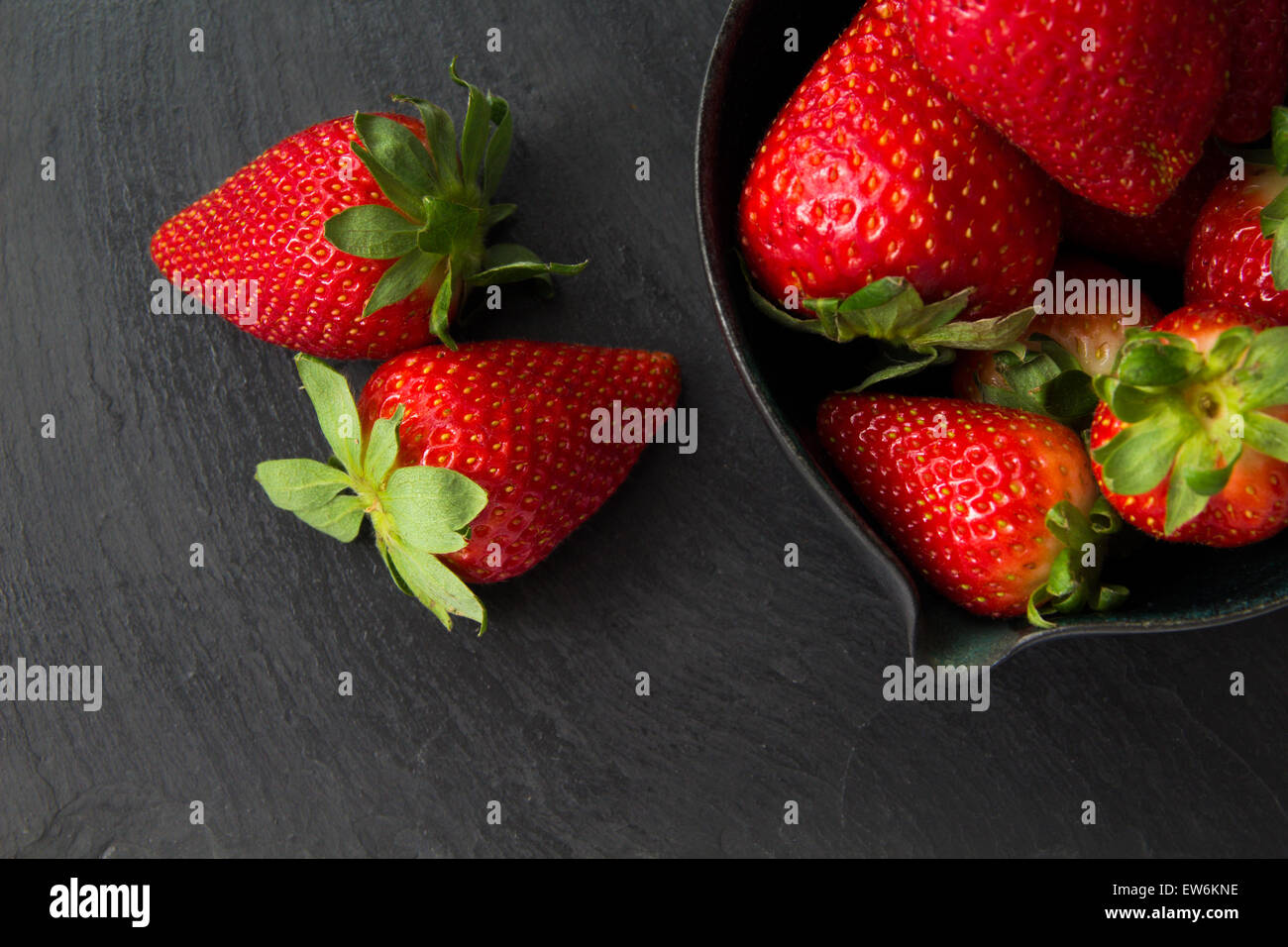 Strawberries on slate background hi-res stock photography and images ...