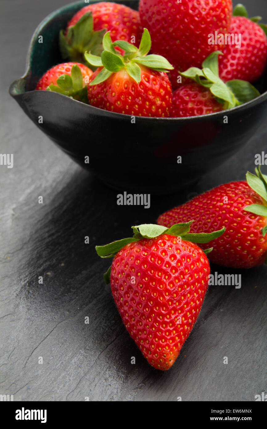 Strawberries on slate background hi-res stock photography and images ...