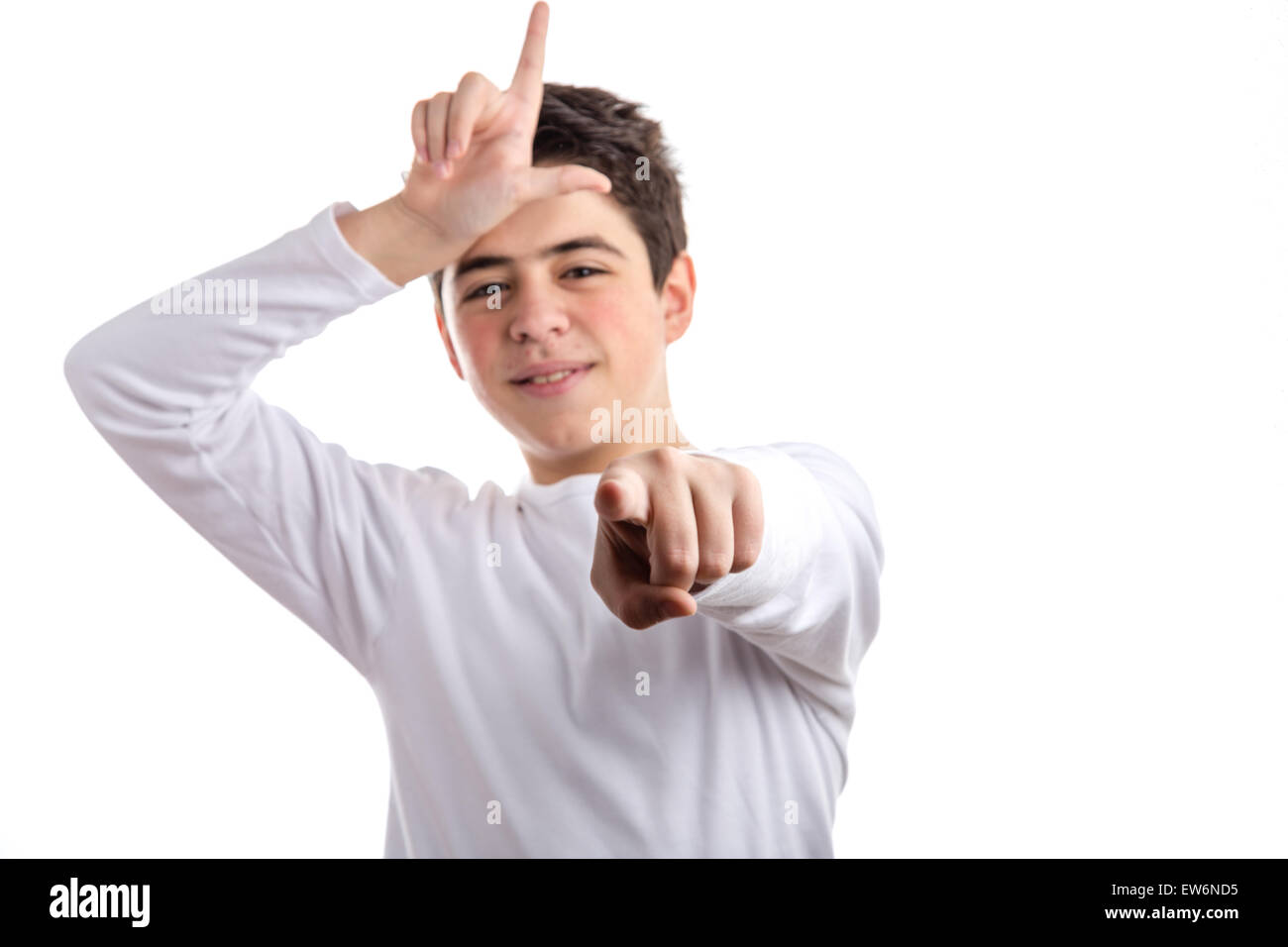 Hispanic teen with acne skin in a white long sleeve t-shirt smiles ...