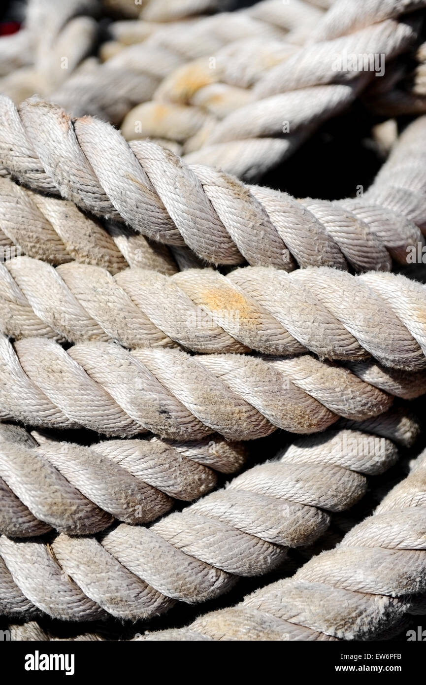 Industrial detail with a heap of old maritime sea ropes Stock Photo - Alamy
