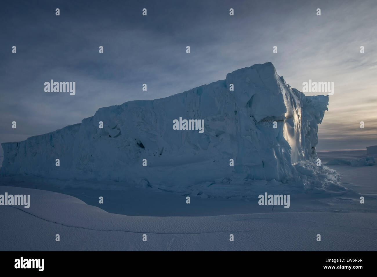 Iceburg frozen into sea ice near cape evans hi-res stock photography ...